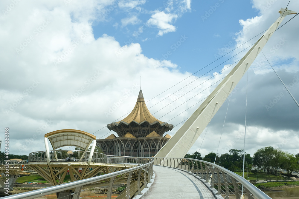 A leading line picture of Darul Hana Bridge with Sarawak State Assembly ...