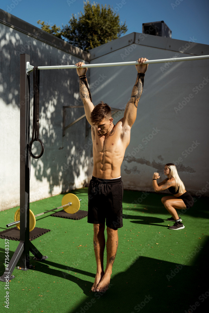 Calisthenics workout for a man and woman Stock Photo | Adobe Stock