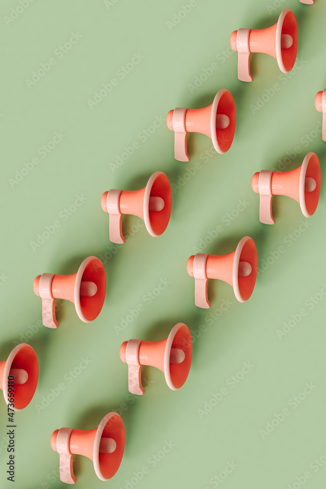 multiple megaphones crossing the frame on green Stock Photo | Adobe Stock