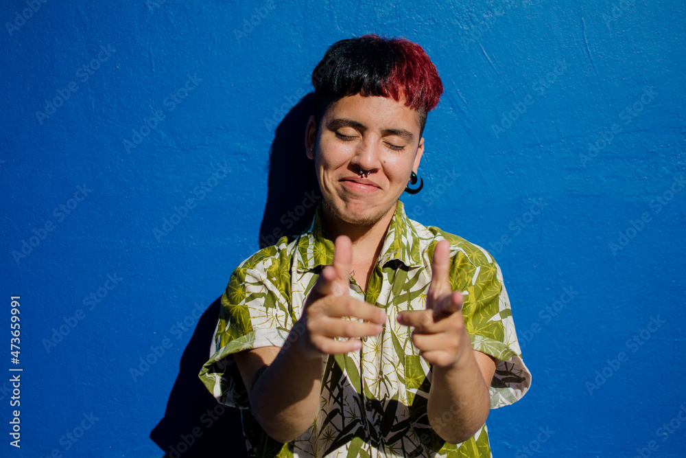 Fun gen z latino transgender man portrait Stock Photo | Adobe Stock