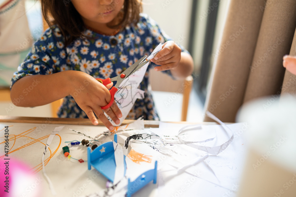 child cutting paper Stock Photo | Adobe Stock
