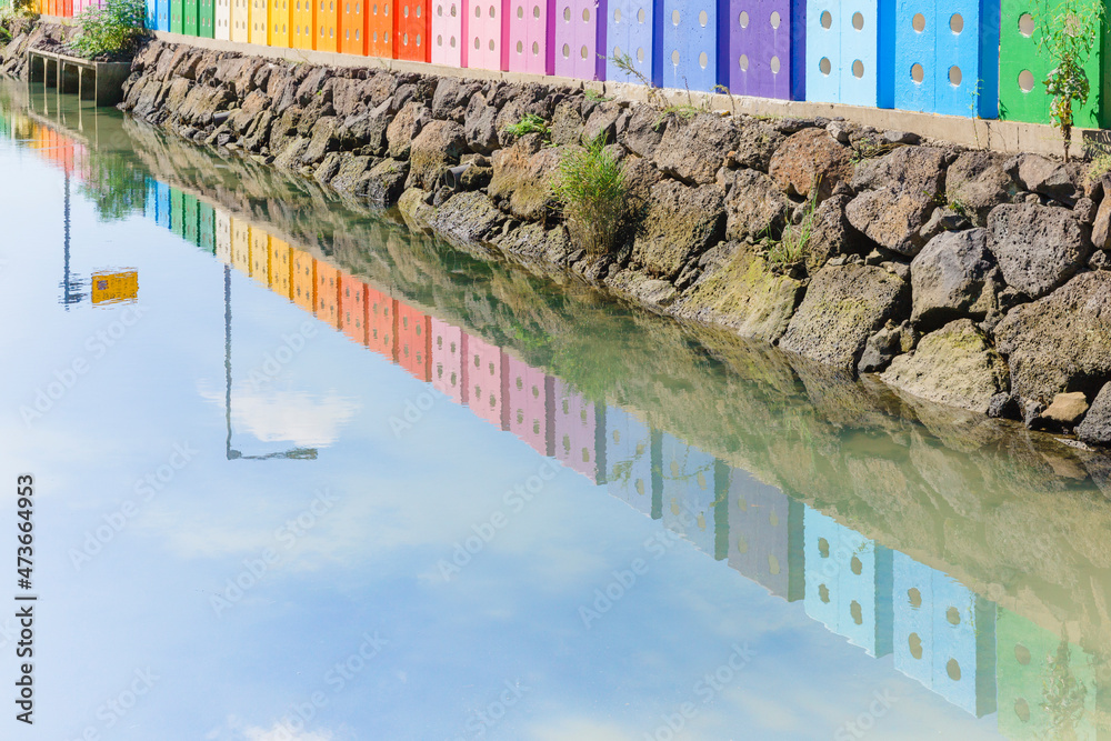 Rainbow-colored guardrail. Stock Photo | Adobe Stock