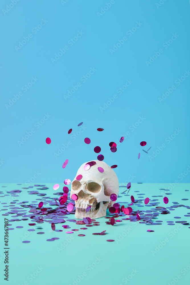 Confetti falling on human skull Stock Photo | Adobe Stock