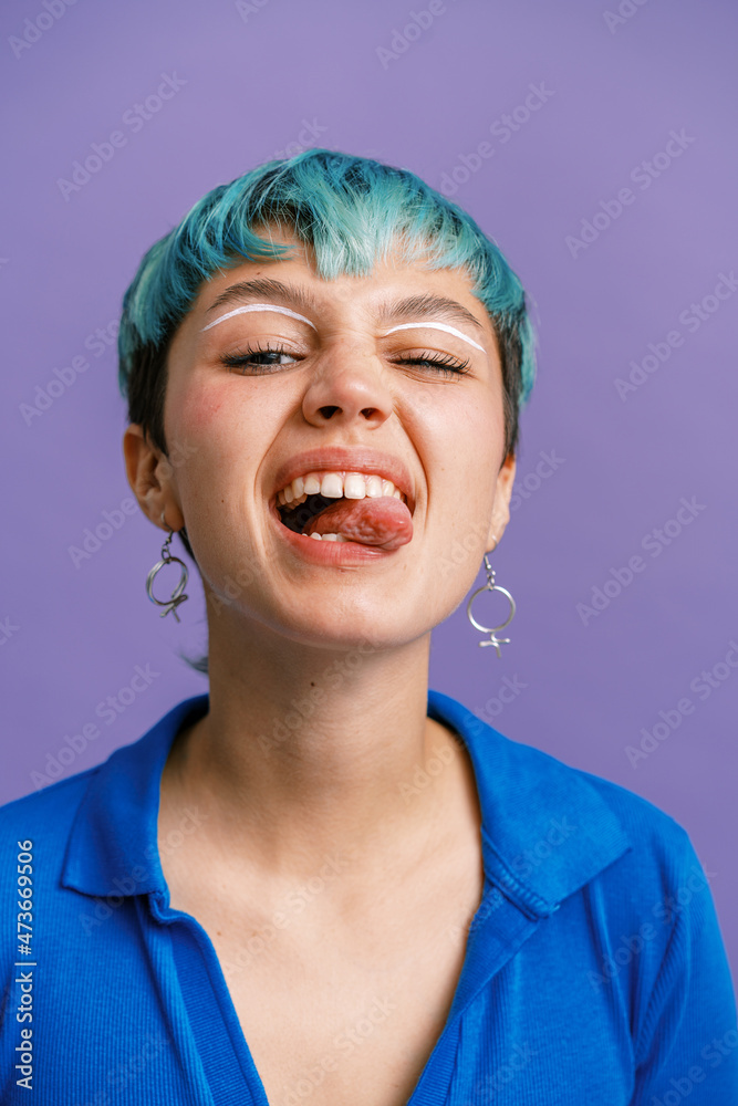 Flirty young woman licking lips Stock Photo | Adobe Stock