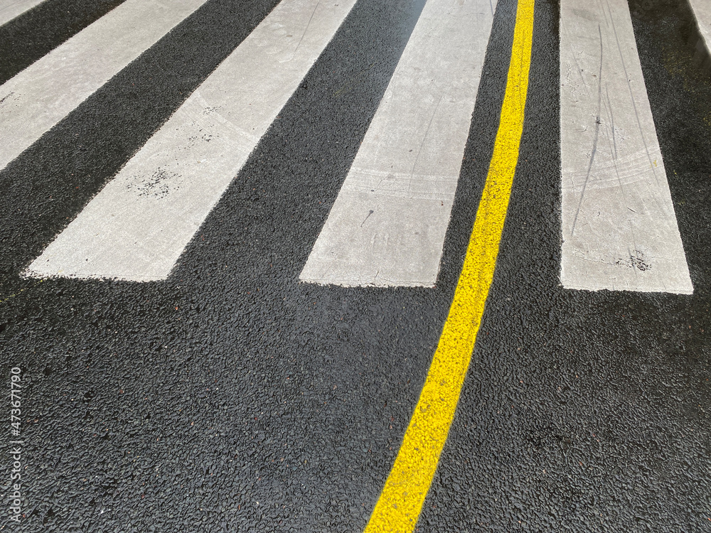 zebra crossing with yellow line Stock Photo | Adobe Stock