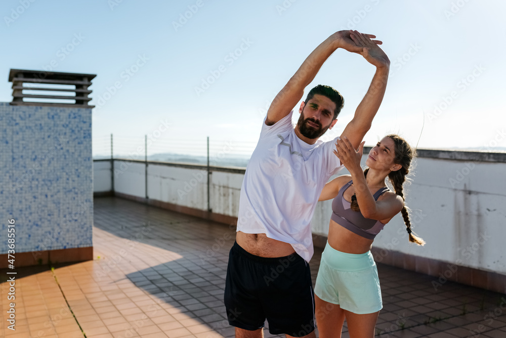 Sports trainer with a fitness trainee Stock Photo | Adobe Stock