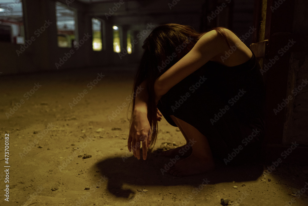 lonely young woman curled up Stock Photo | Adobe Stock