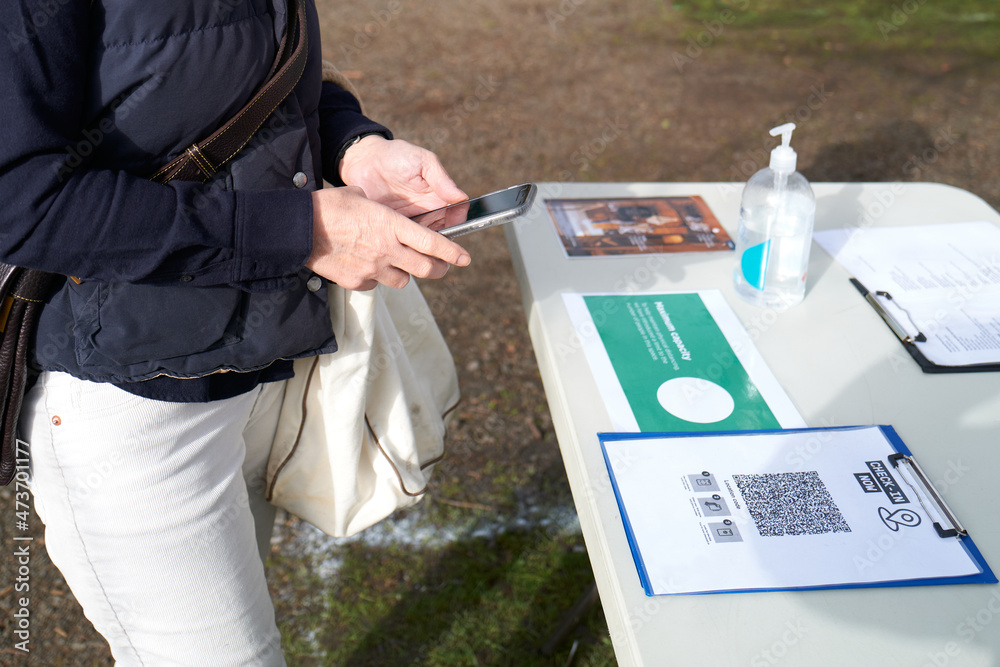 Covid QR code check-in point at outdoor market Stock Photo | Adobe Stock