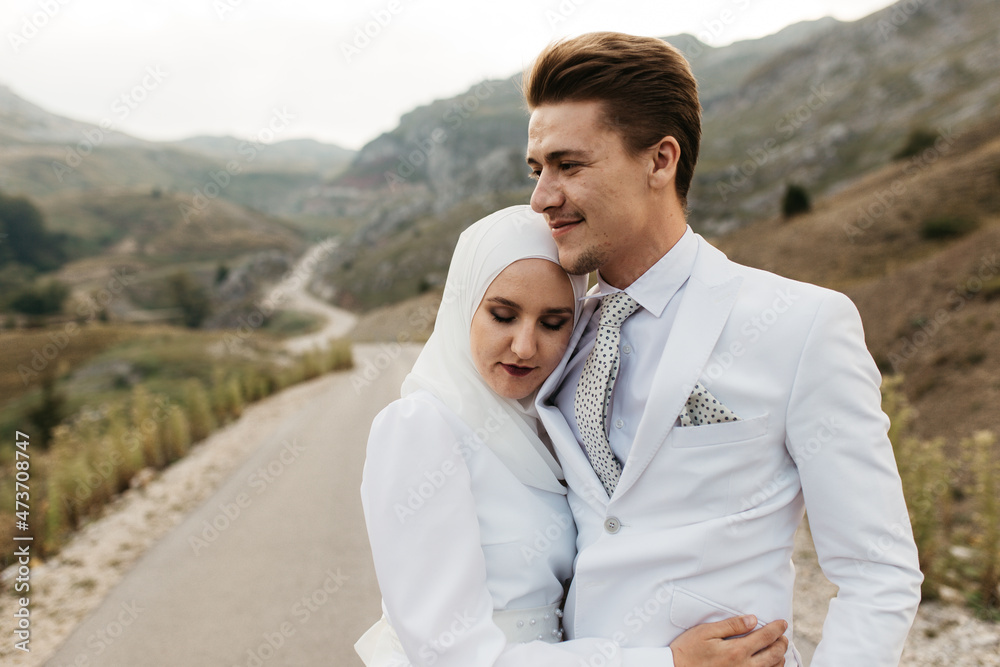 Happy Muslim couple walking together Stock Photo | Adobe Stock