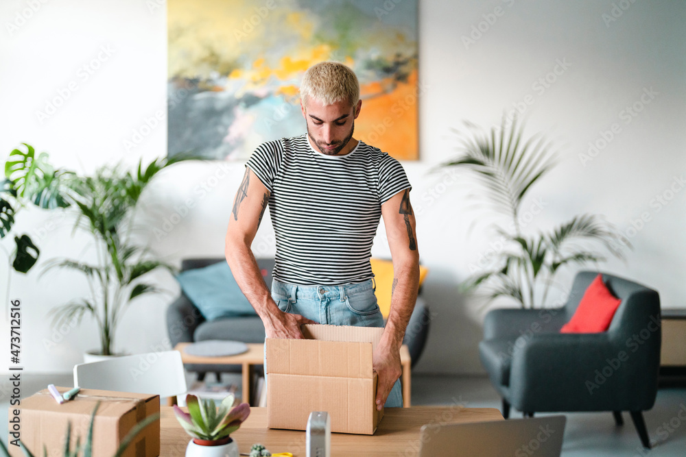 Man packing a box Stock Photo | Adobe Stock