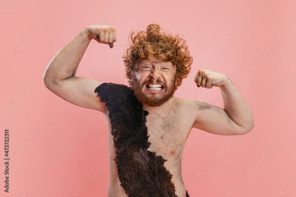 Cropped portrait of artistic man in charater of neanderthal showing ...