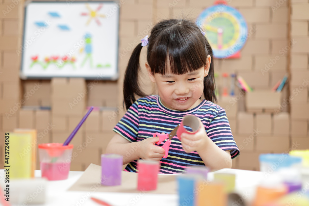 young girl making craft for homeschooling Stock Photo | Adobe Stock