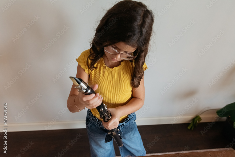 Preparing to practice musical instrument. Stock Photo | Adobe Stock
