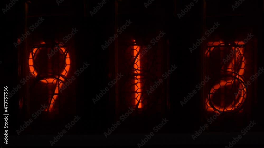 Retro vacuum tube display on the device counts seconds. Displaying ...