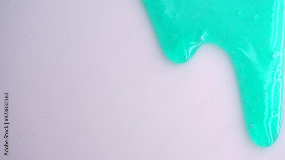 Clear blue Gel Cosmetic With Molecule Bubbles As It Slowly Slides Down ...