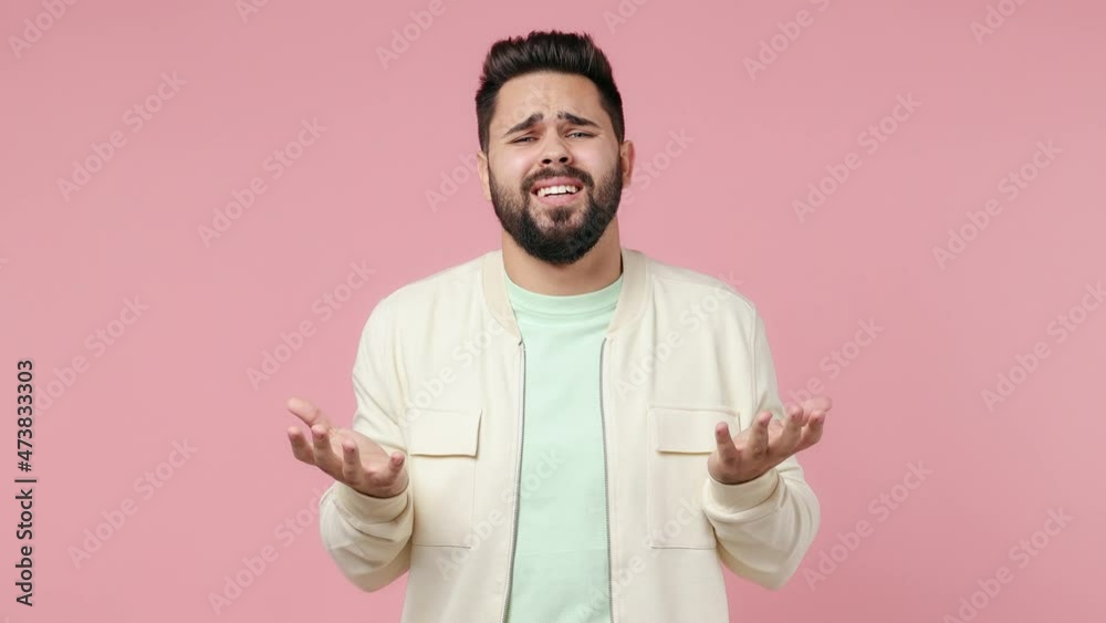 Vidéo Stock Sad upset worried disturb displeased young bearded brunet ...