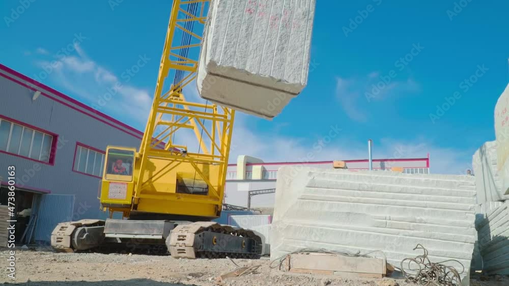 Heavy Stone Block Lifted By Industrial Crane Machine. Yellow Industrial ...