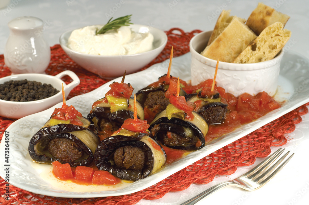 Traditional delicious Turkish food; Kofte kebab wrapped in eggplant ...