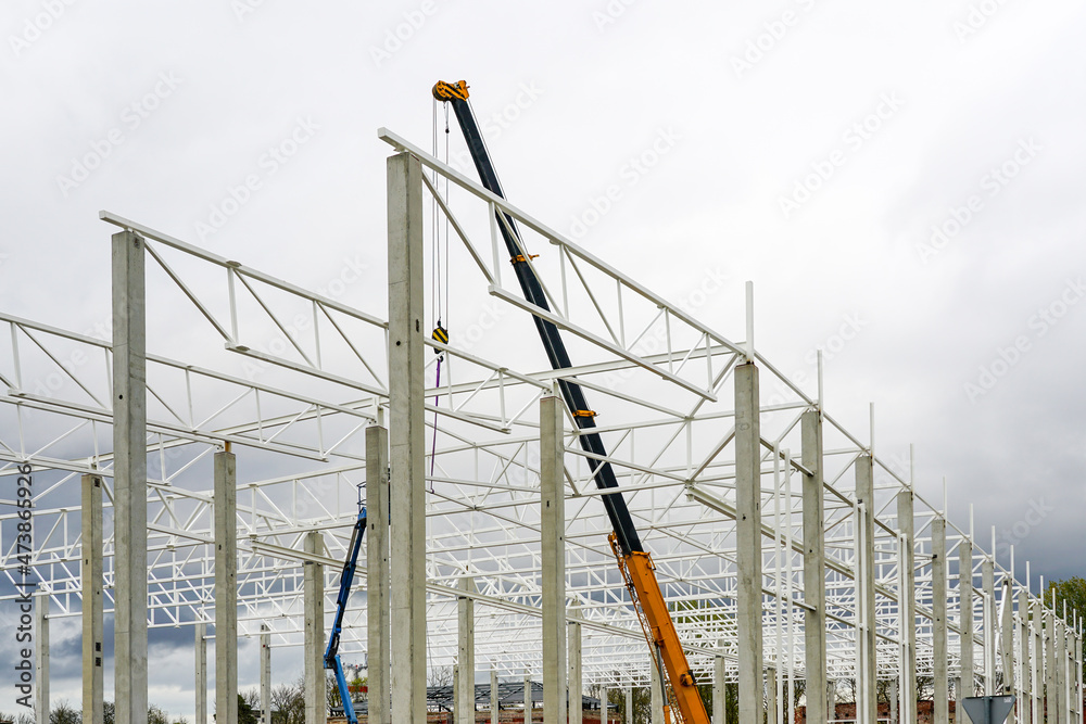 crane with telescopic boom in the assembly of metal structures of an ...