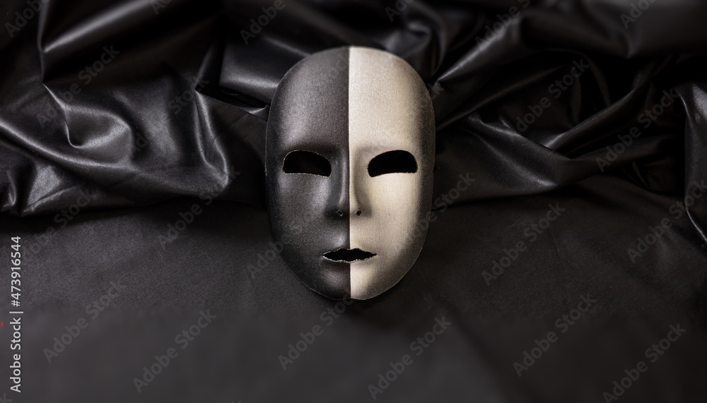 Carnival Venetian two faced mask, half black half silver on dark satin ...