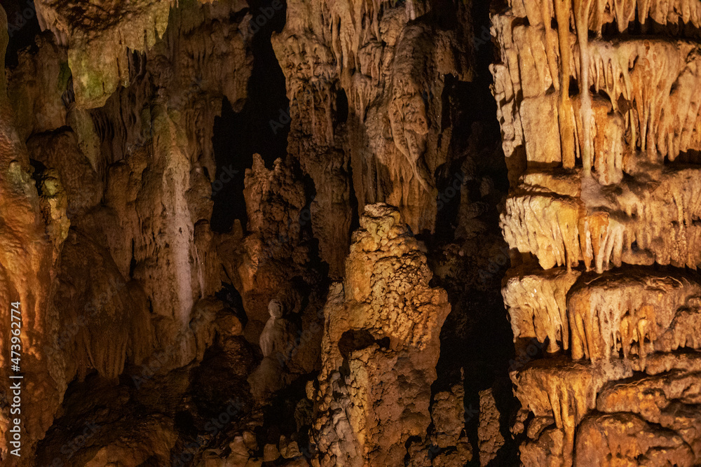 abstract background of stalactites, stalagmites and stalagnates in the ...