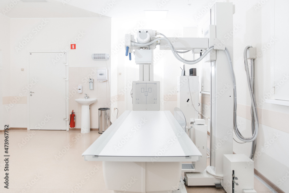 X-ray department in modern hospital. Radiology room with scan machine ...