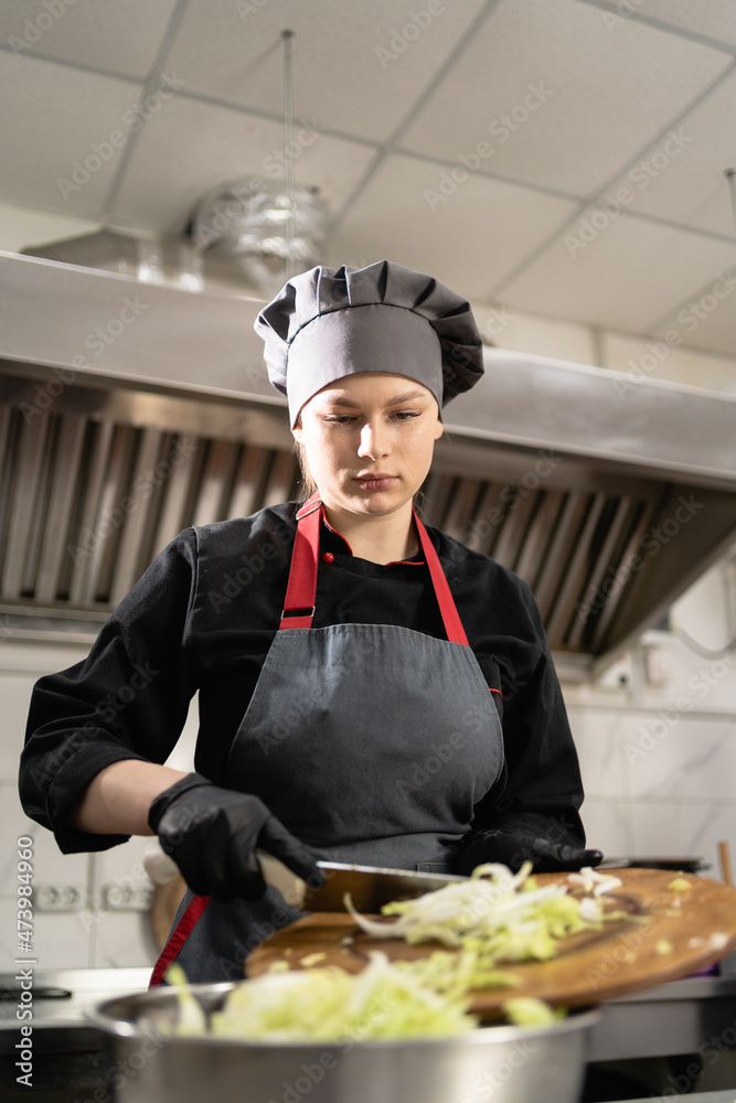 takeaway food in the restaurant. woman chef in special clothes in the ...