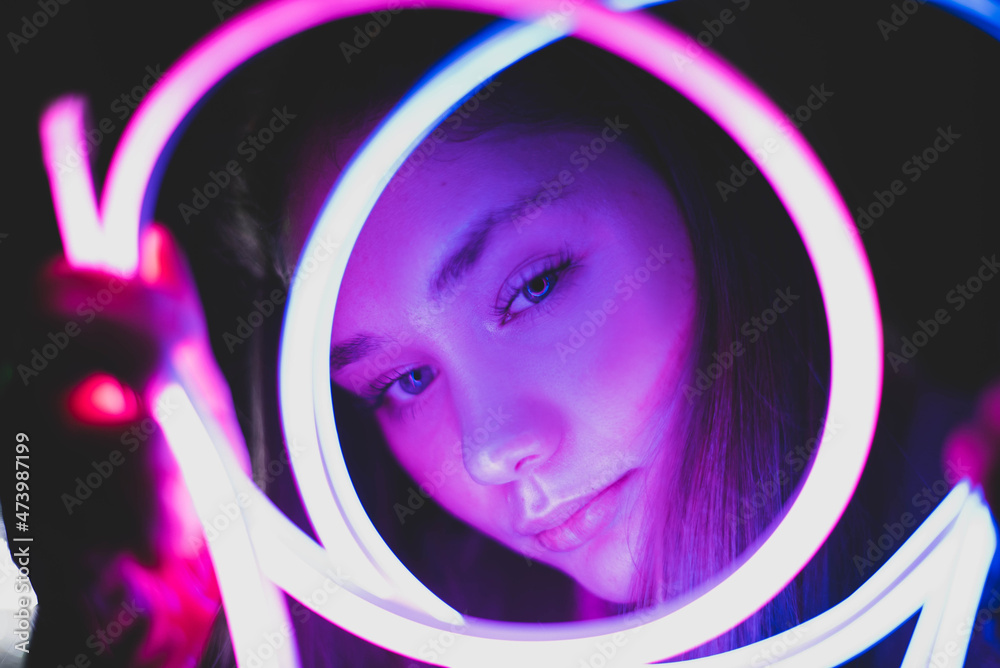 Cinematic night portrait of girl and neon lights. Fashion. Woman in ...