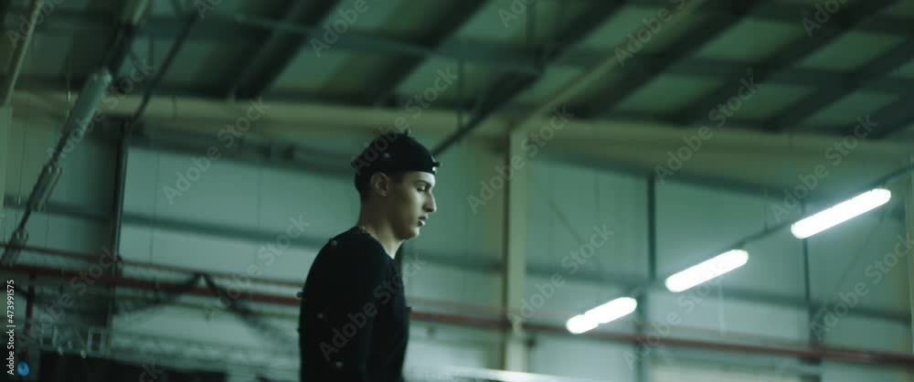 Two professional players in motion capture suits playing basketball as ...