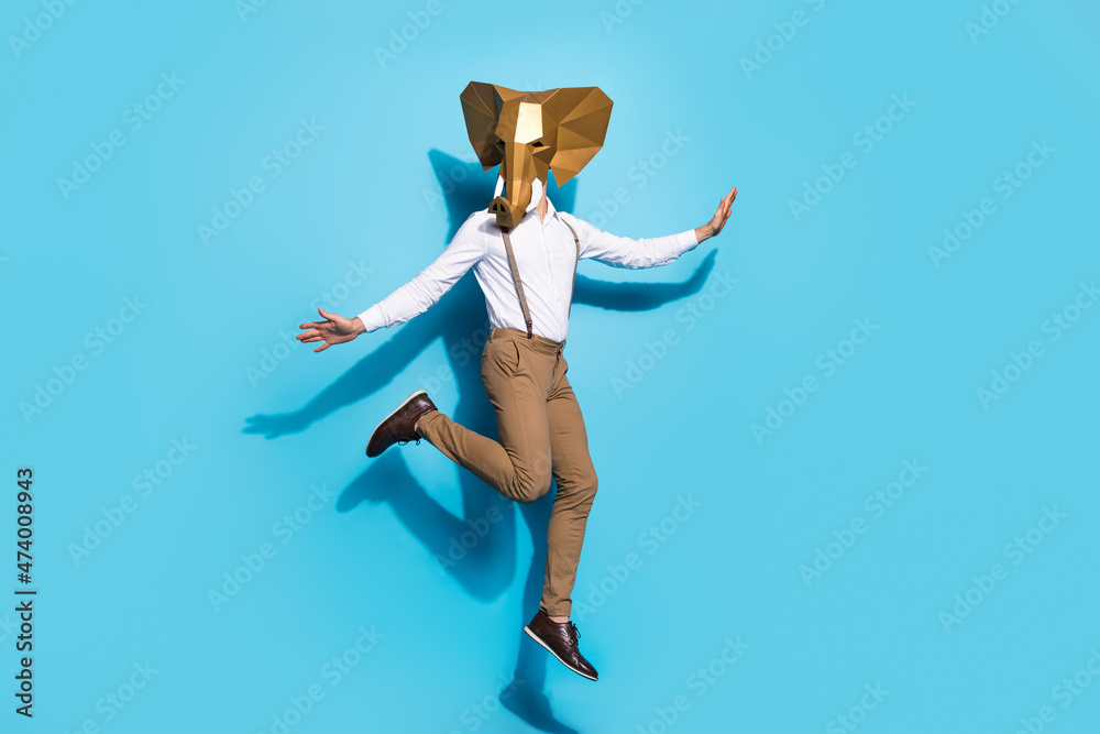 Full length photo of young guy jump carefree surreal incognito event ...