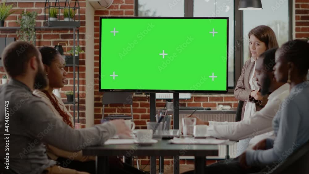 Vidéo Stock Workmates using isolated green screen on monitor at ...