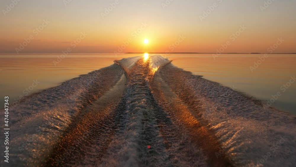 Video „Look back to vivid sunset from speedboat running fast at calm ...