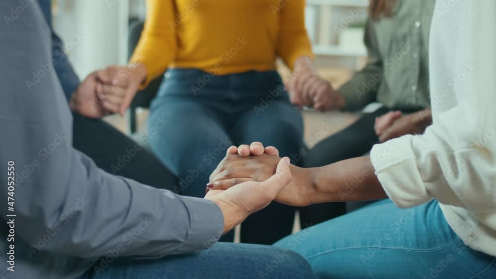 Close-up. A Group Of Mixed-race People Join Hands in a Circle During a ...