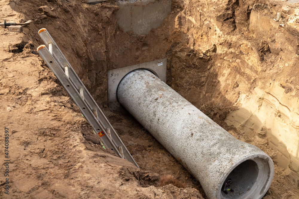 Concrete pipeline for a sewage and waste water system. Stock Photo ...
