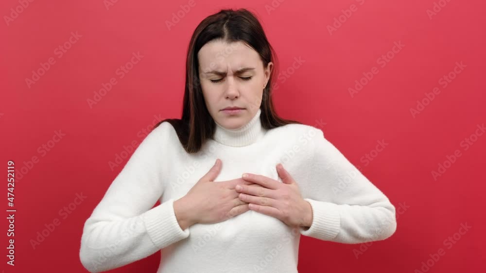 Portrait of sad young woman 20s old years holding hands on chest ...