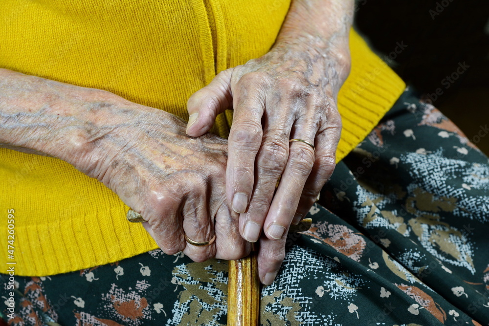 Aging process - very old senior woman hands isolated on black ...
