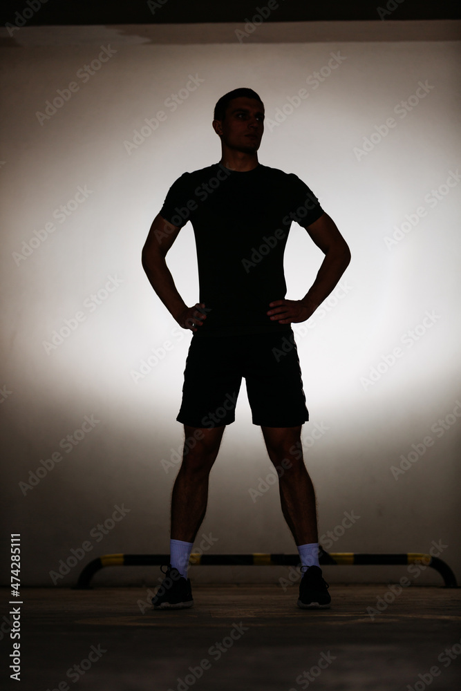 Dark silhouette of a strong man body on white background. Confident ...