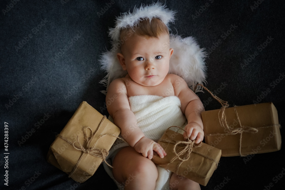 happy innocent newborn baby in white angel outfit with feather wings ...