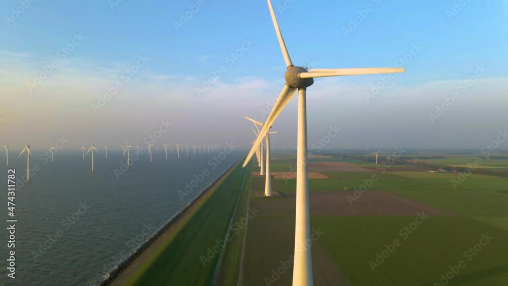 Wind turbines in the early morning, windmill park in the Netherlands ...
