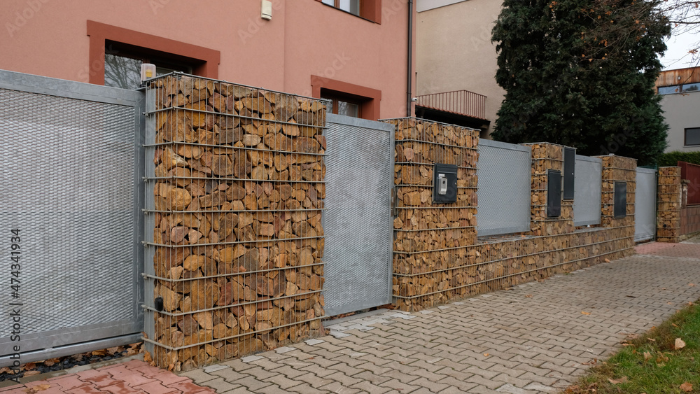 Gabion retaining wall - brown stones in gabion metallic baskets kept by ...