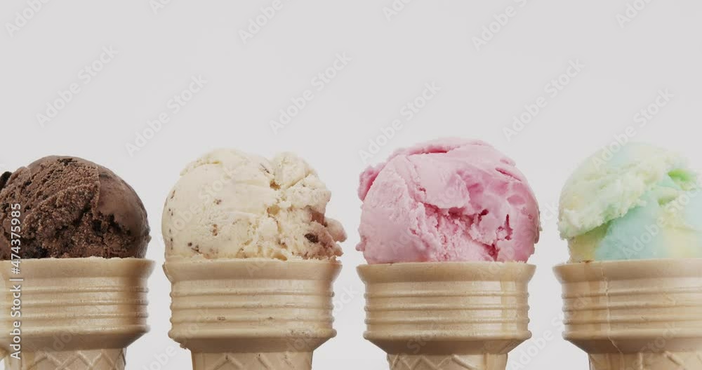 Close up, Zoom in, The various flavors of ice cream scooped on a cone ...