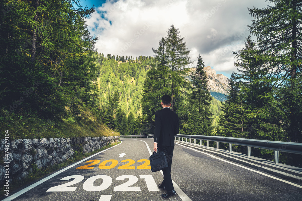 The 2022 New Year journey and future vision concept . Businessman ...