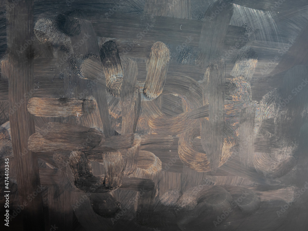 Dirty tablet. Fingerprints form drawings made with dust, moisture and ...