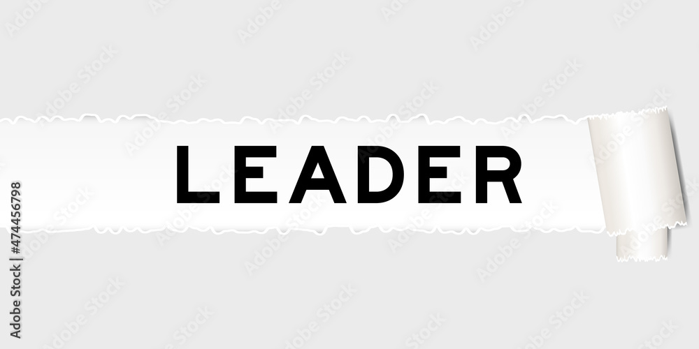 Ripped gray paper background that have word leader under torn part ...