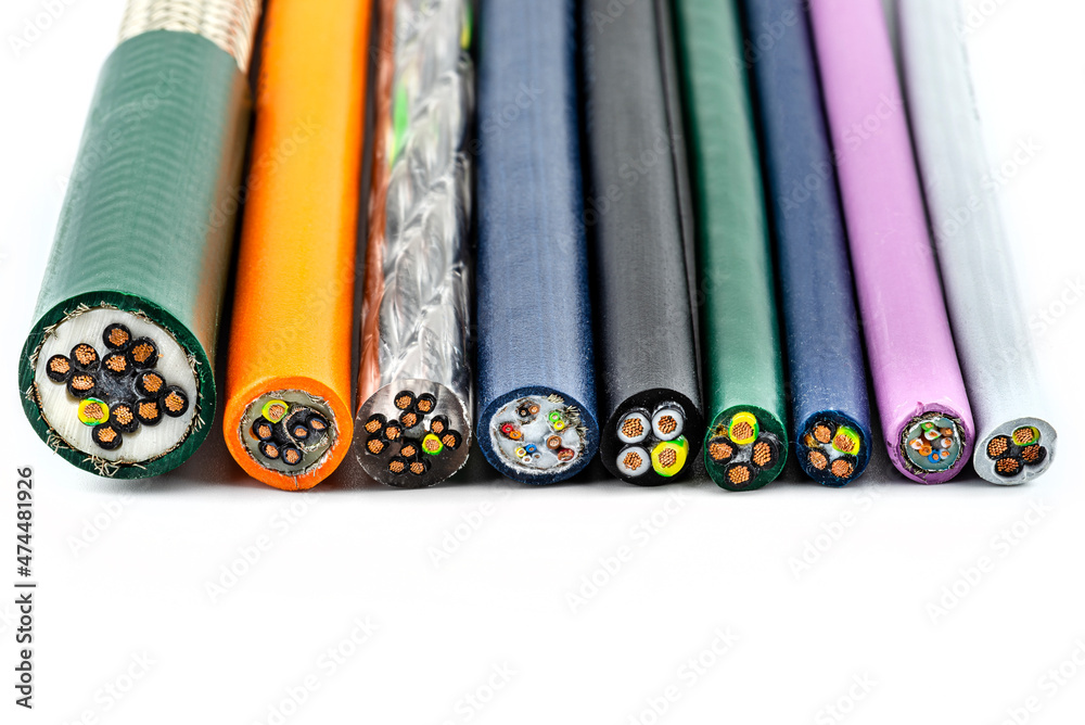 Macro photo of a cross section of various electric cables arranged in a ...
