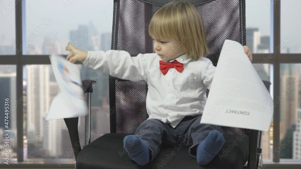 Detail of hands give paperwork,to little child with red bow child throw ...