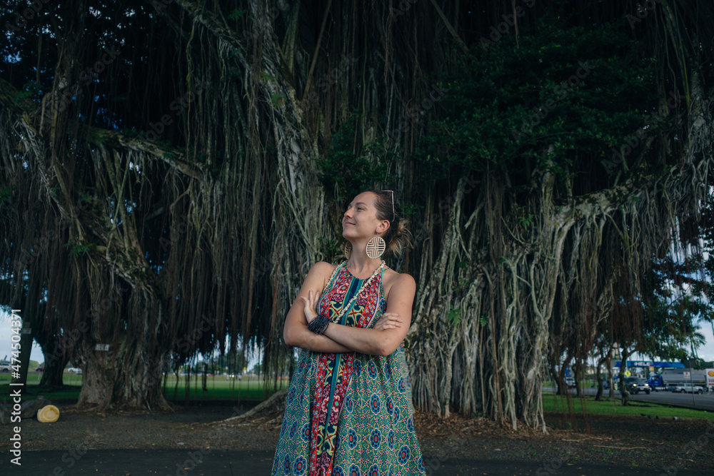 girl on Banyan Drive is a tree-lined street at the shoreline of Hilo ...
