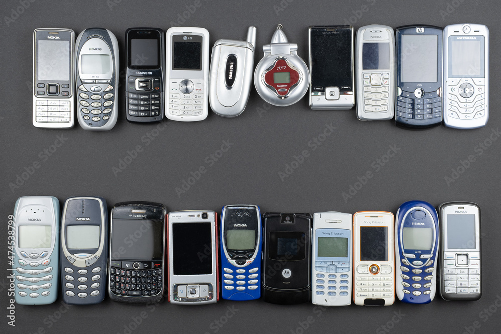 Prague, CZ - 12 December 2021: A lot of old used mobile phones with ...