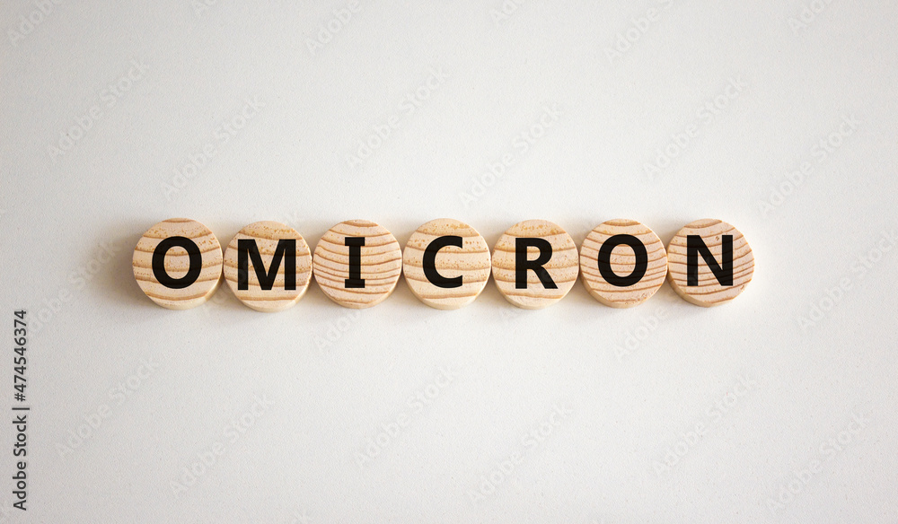 Covid-19 new omicron strain symbol. The concept word Omicron on wooden ...