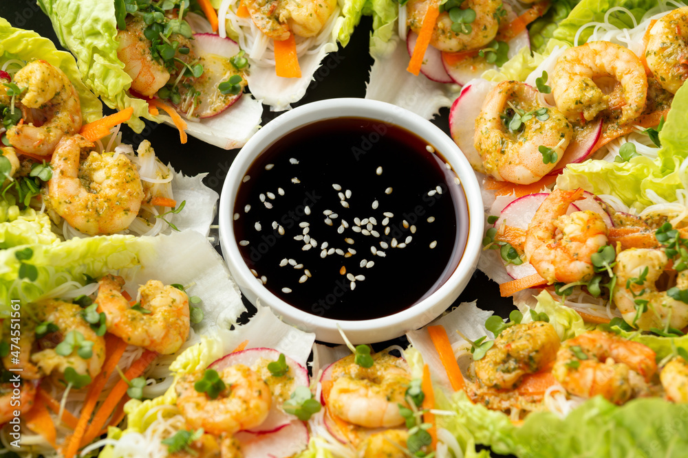 Lettuce wraps with Spicy prawn, shrimp and rice vermicelli noodles on ...